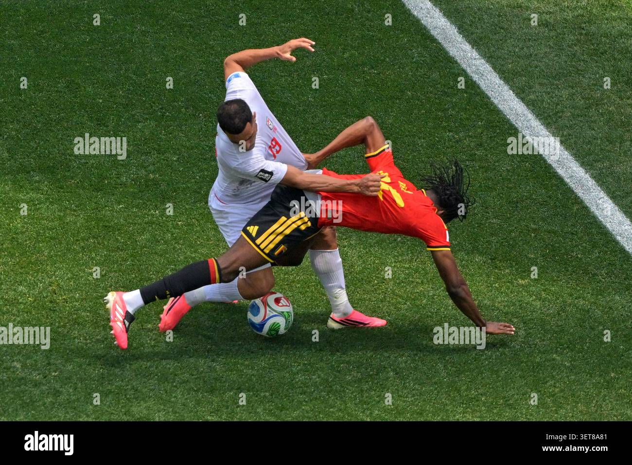 Iran's Ali Nemati (19) and Belgium's Nathan Ngoy (25) fight for the ...