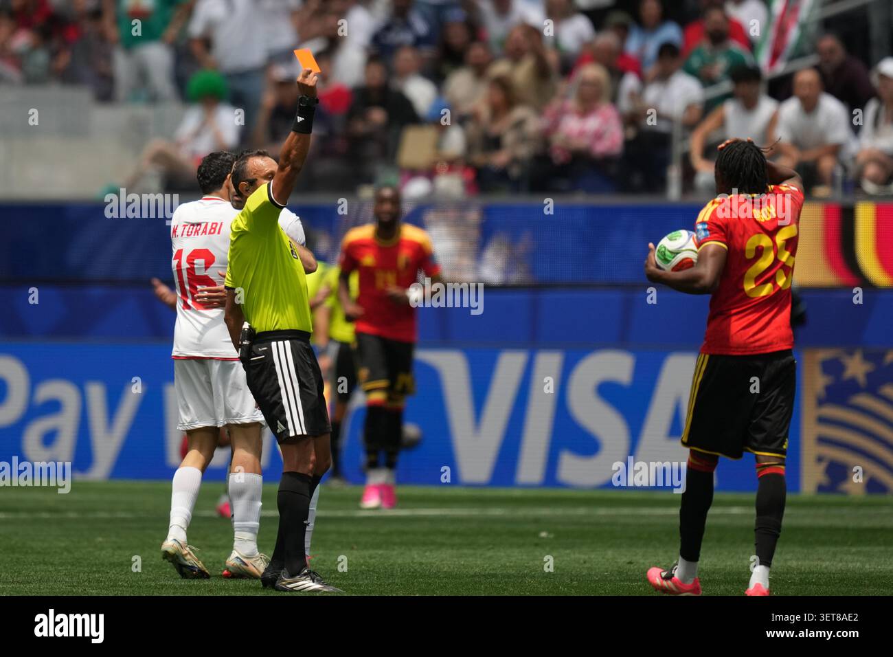 Referee Dario Herrera of Argentina shows a red card to Belgium's Nathan ...
