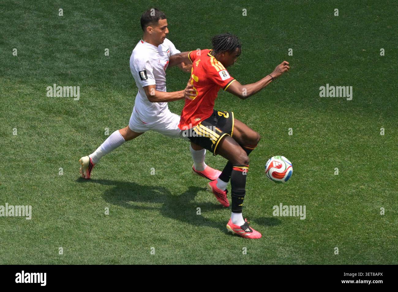 Iran's Ali Nemati (19) and Belgium's Nathan Ngoy (25) fight for the ...