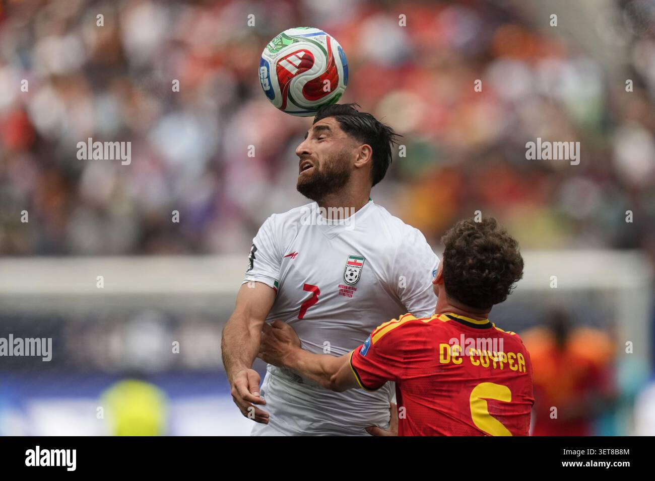 Iran's Alireza Jahanbakhsh, top, heads the ball challenged by Maxim De ...