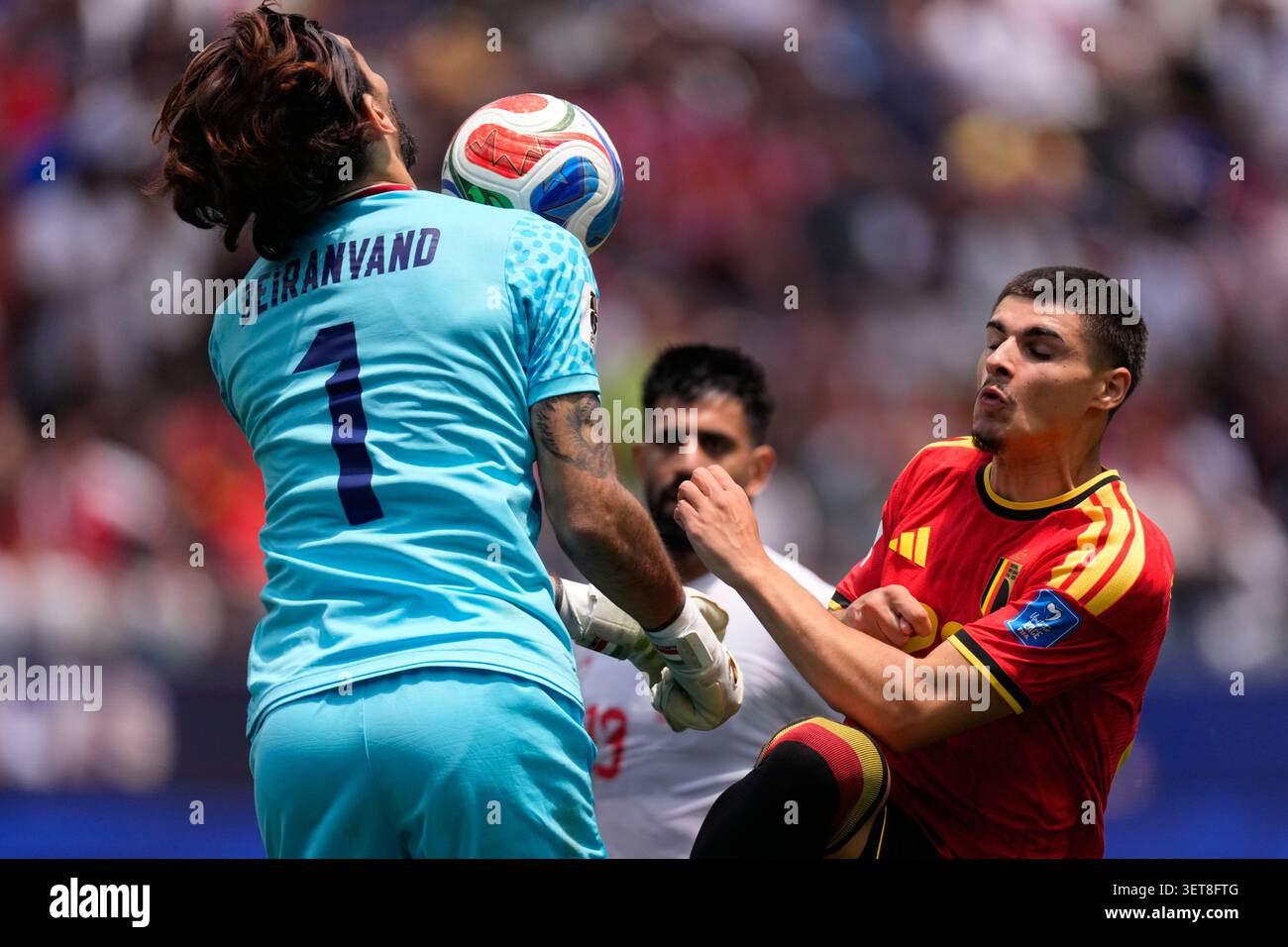Iran goalkeeper Alireza Beiranvand (1) blocks an attack of Belgium's ...