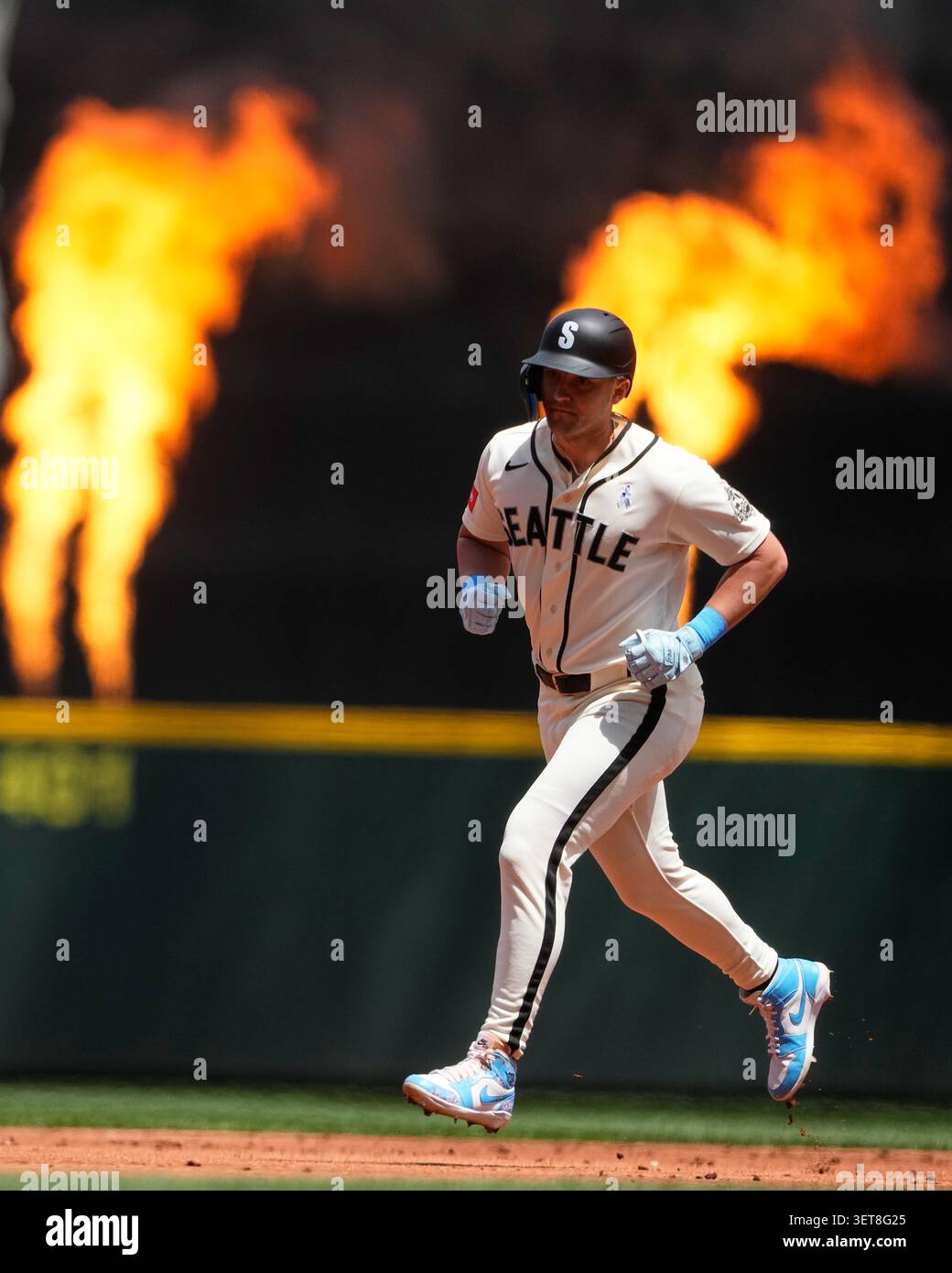 Seattle Mariners' Dominic Canzone jogs the bases after hitting a solo ...