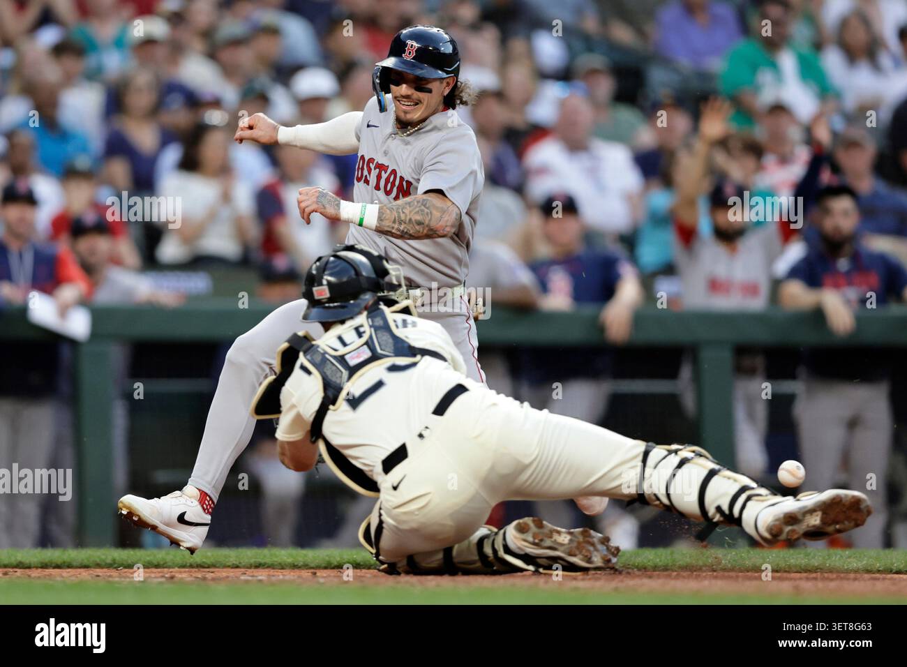 Boston Red Sox's Jarren Duran scores as the ball bounces away from ...