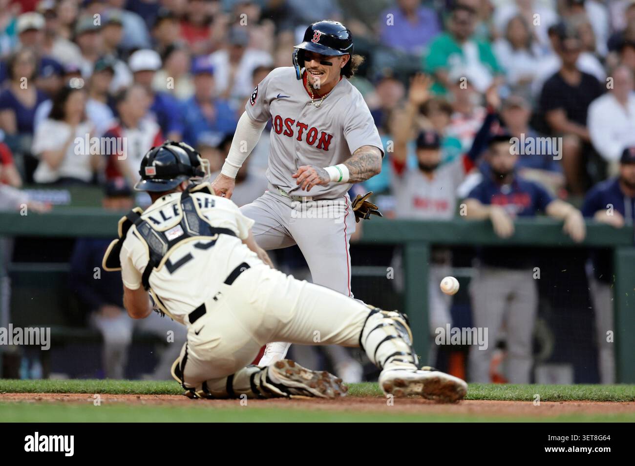 Boston Red Sox's Jarren Duran scores as the ball bounces away from ...