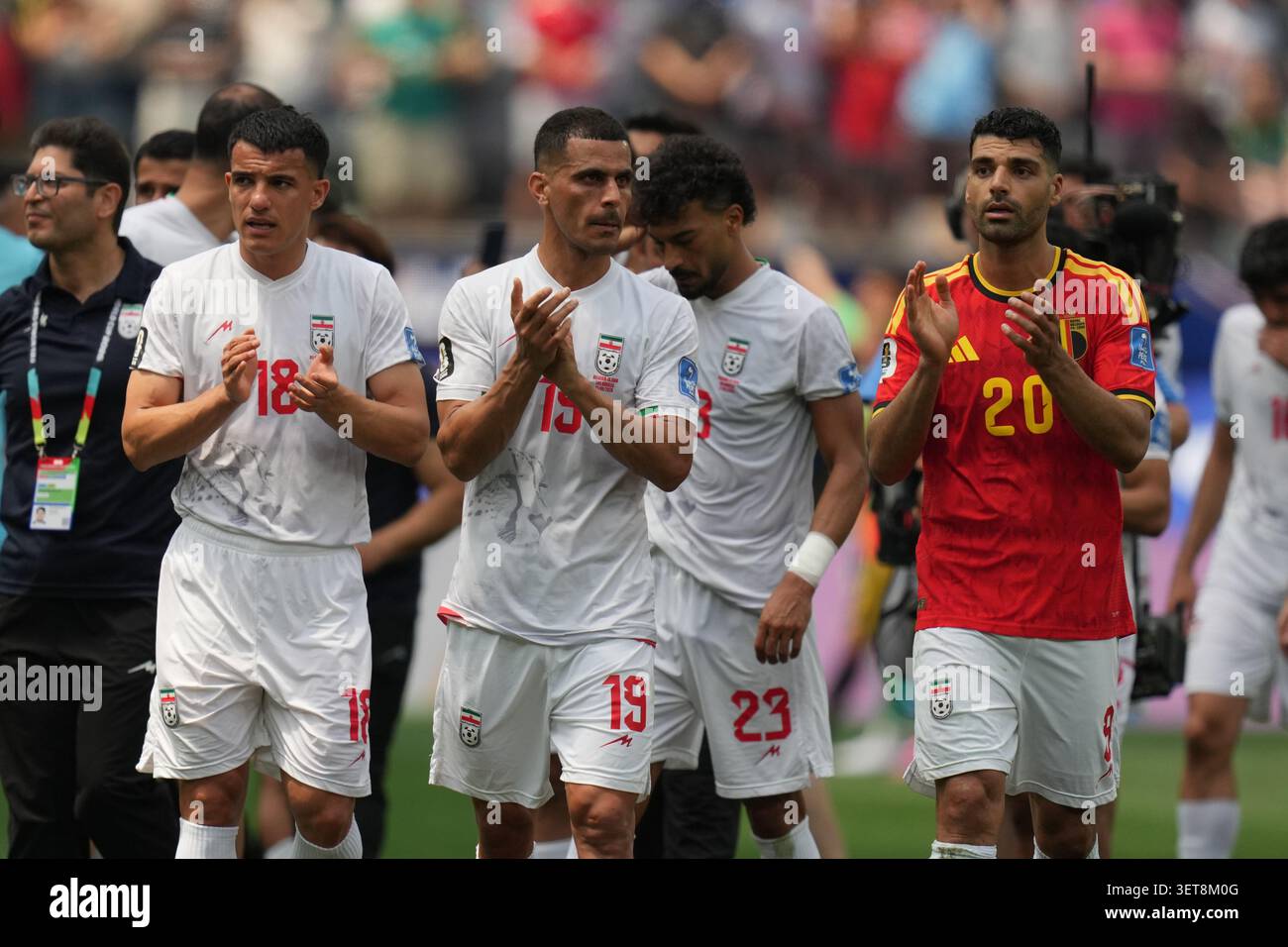 Players of Iran greet fans at the end of the World Cup Group G soccer ...