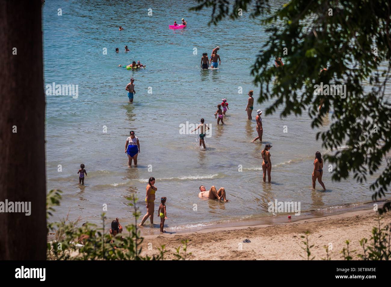 Croatians and tourists gather along the Firule beach as rising ...