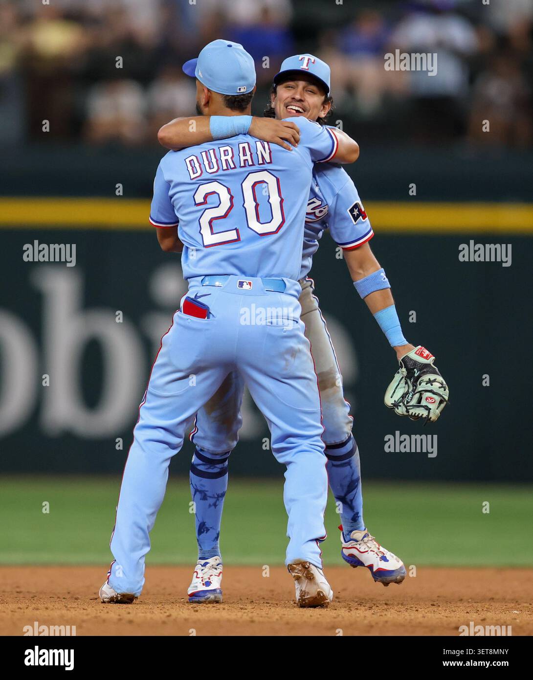 Texas Rangers infielders Nicky Lopez, back, and Ezequiel Duran (20 ...