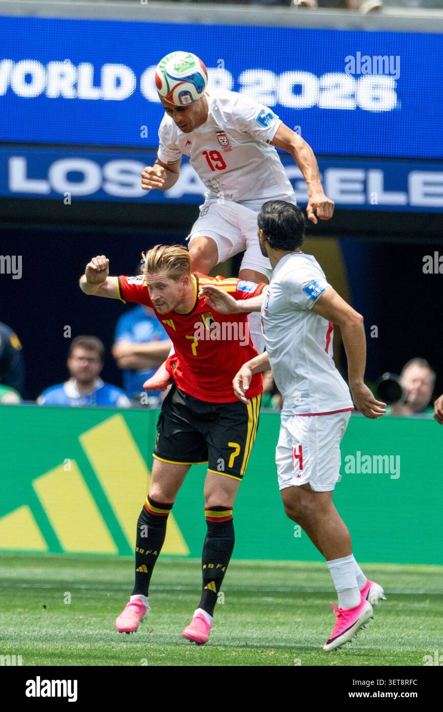 IR Iran' Ali Nemati (19) heads the ball Ober Belgium' Kevin De Bruyne ...