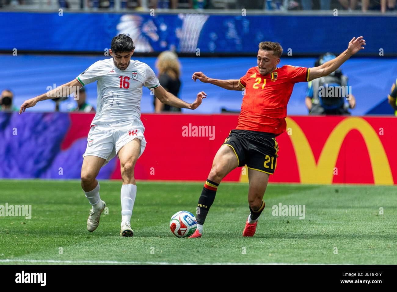 IR Iran' Mehdi Torabi (16) and Belgium' Timothy Castagne (21) vie for ...