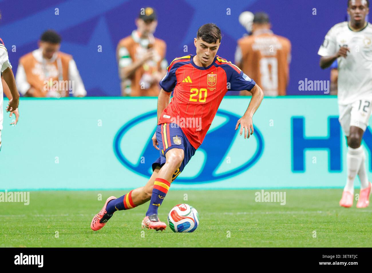 Spain's Pedri dribbles the ball during the World Cup Group H soccer ...