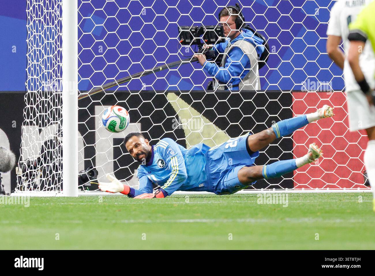 Saudi Arabia goalkeeper Mohammed Alowais makes a save during the World ...