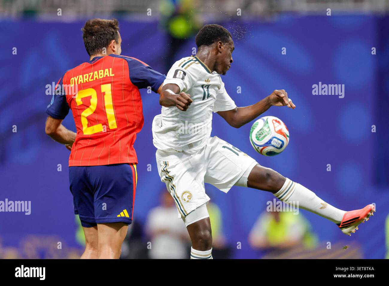 Spain's Mikel Oyarzabal and Saudi Arabia's Saud Abdulhamid go up for a ...