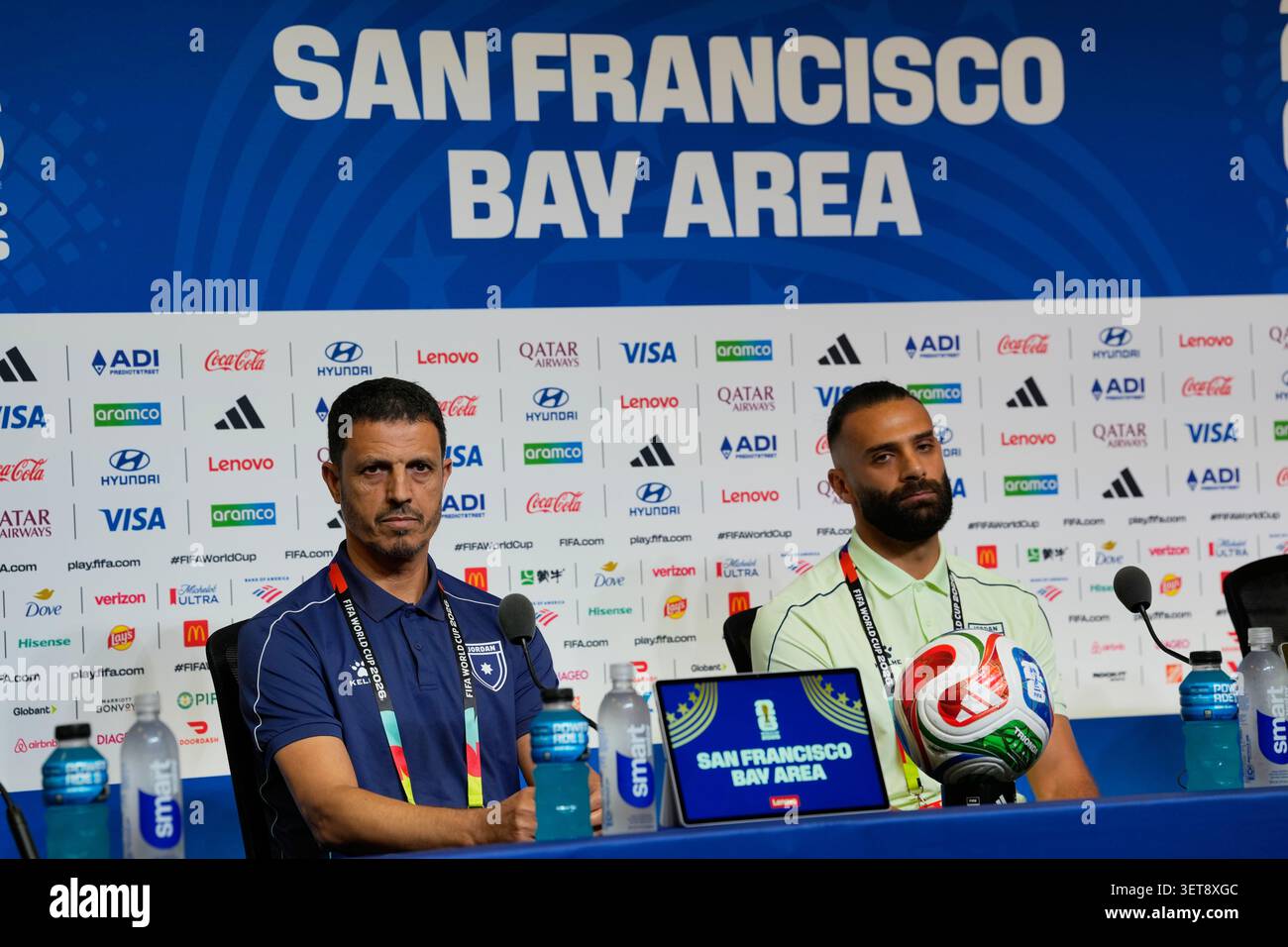 Jordan head coach Jamal Sellami, left, and defender Yazan Al-Arab ...