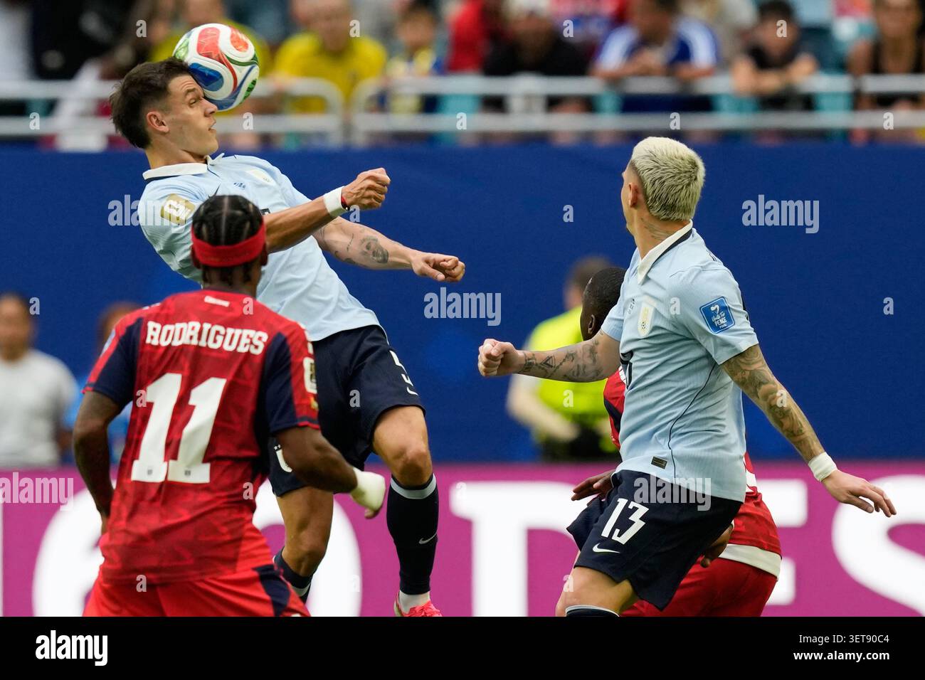 Uruguay's Manuel Ugarte (5) heads the ball during the World Cup Group H ...