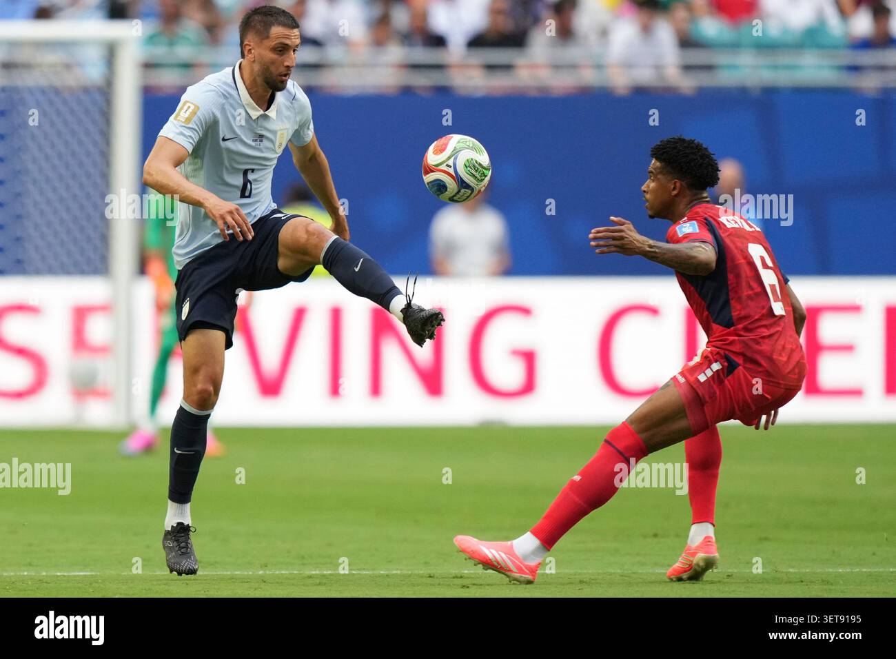 Uruguay's Rodrigo Bentancur, left, kicks the ball past Cape Verde's ...