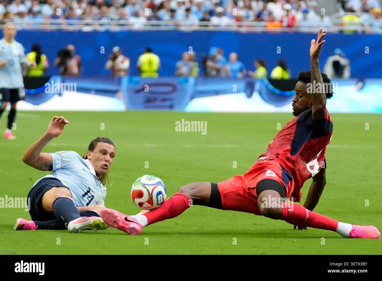 Uruguay's Agustin Canobbio, left, and Cape Verde's Diney Borges vie for ...