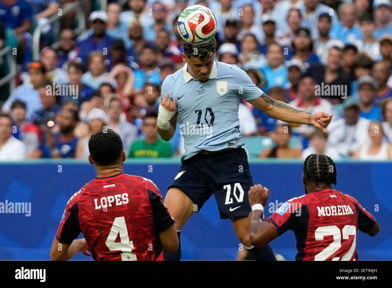 Uruguay's Maxi Araujo, center, heads the ball during the World Cup ...
