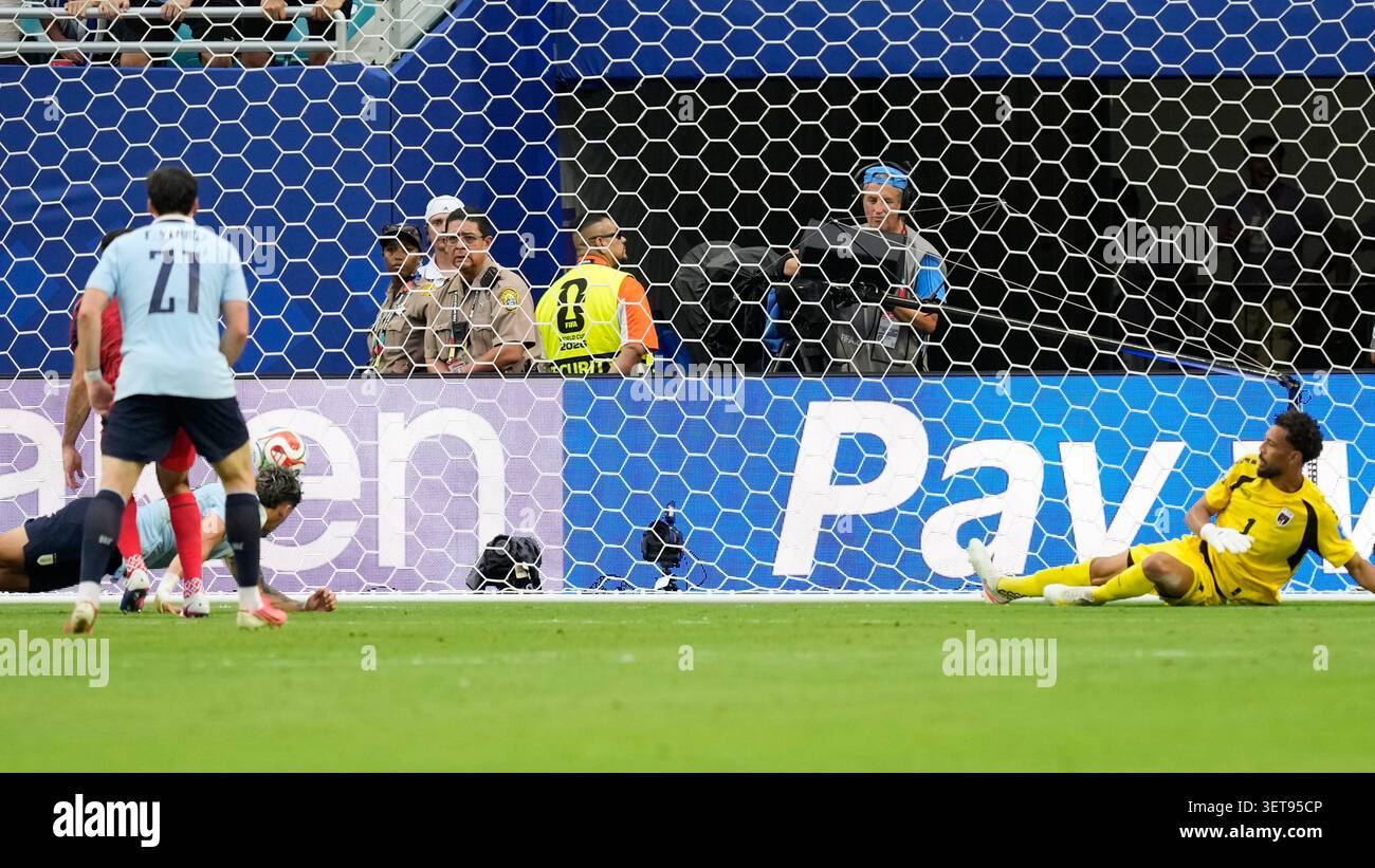 Uruguay's Maxi Araujo, bottom left, scores his team's first goal during ...
