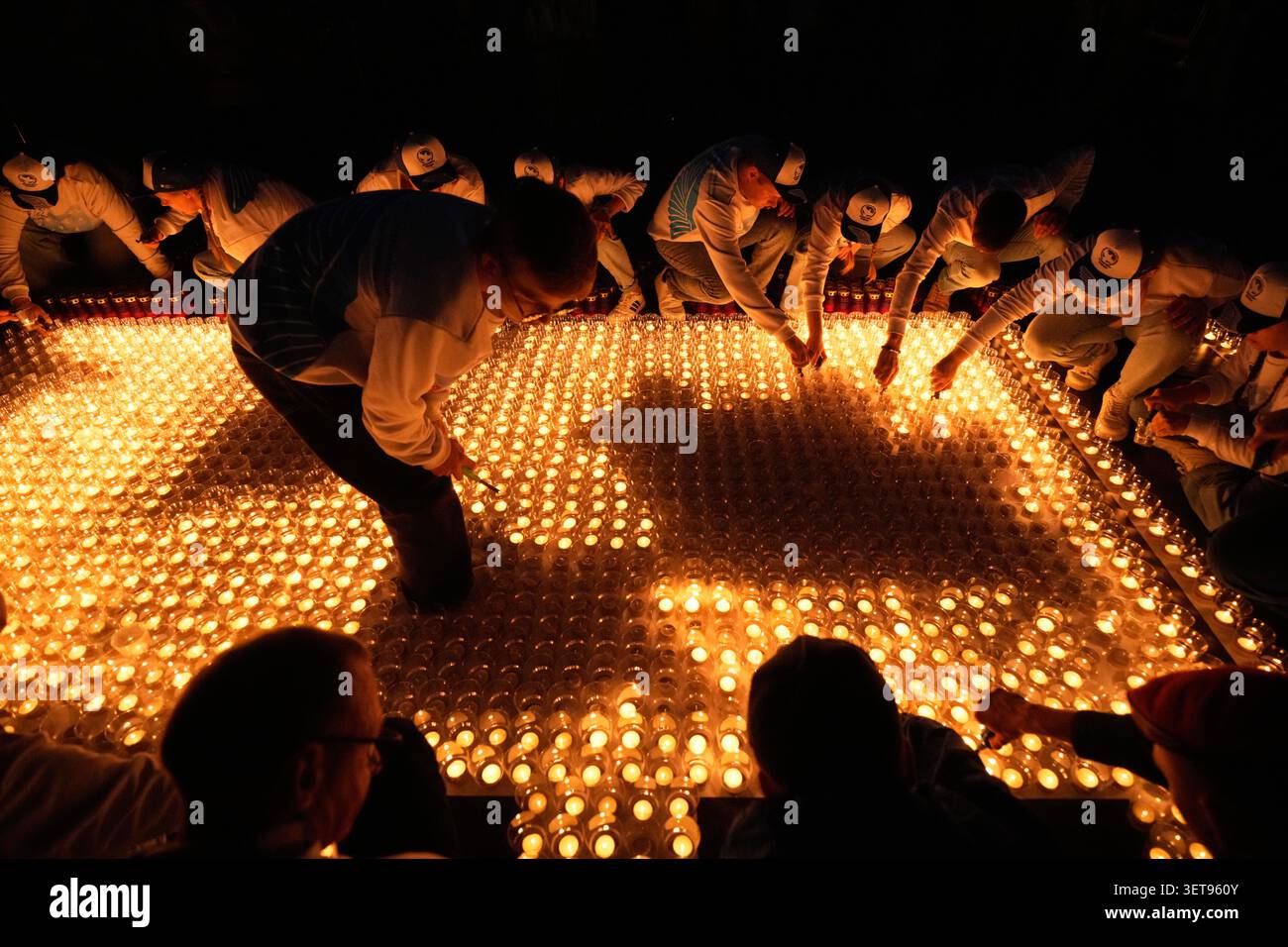People light the candles outside the Victory Museum in Moscow, Sunday ...