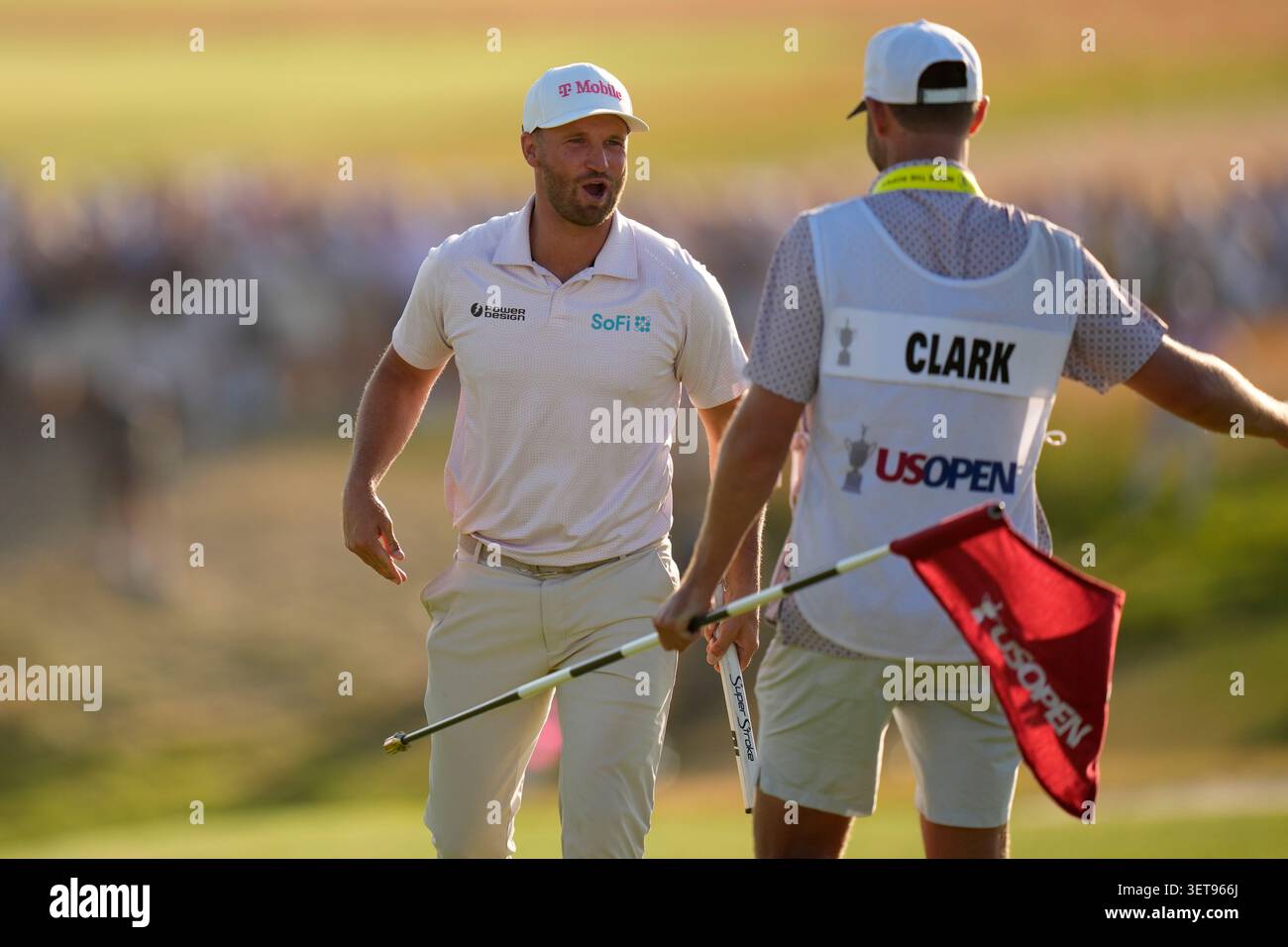 Wyndham Clark celebrates with his caddie David Pelekoudas after winning ...