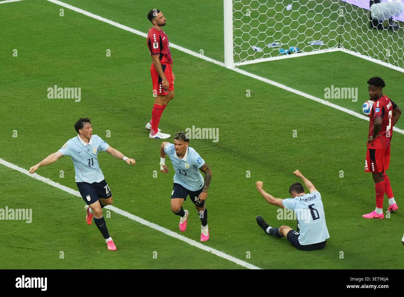 Uruguay's Maxi Araujo, center, celebrates scoring his side's opening ...