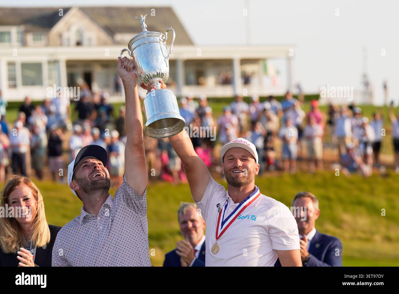 Wyndham Clark celebrates with his caddie David Pelekoudas after winning ...