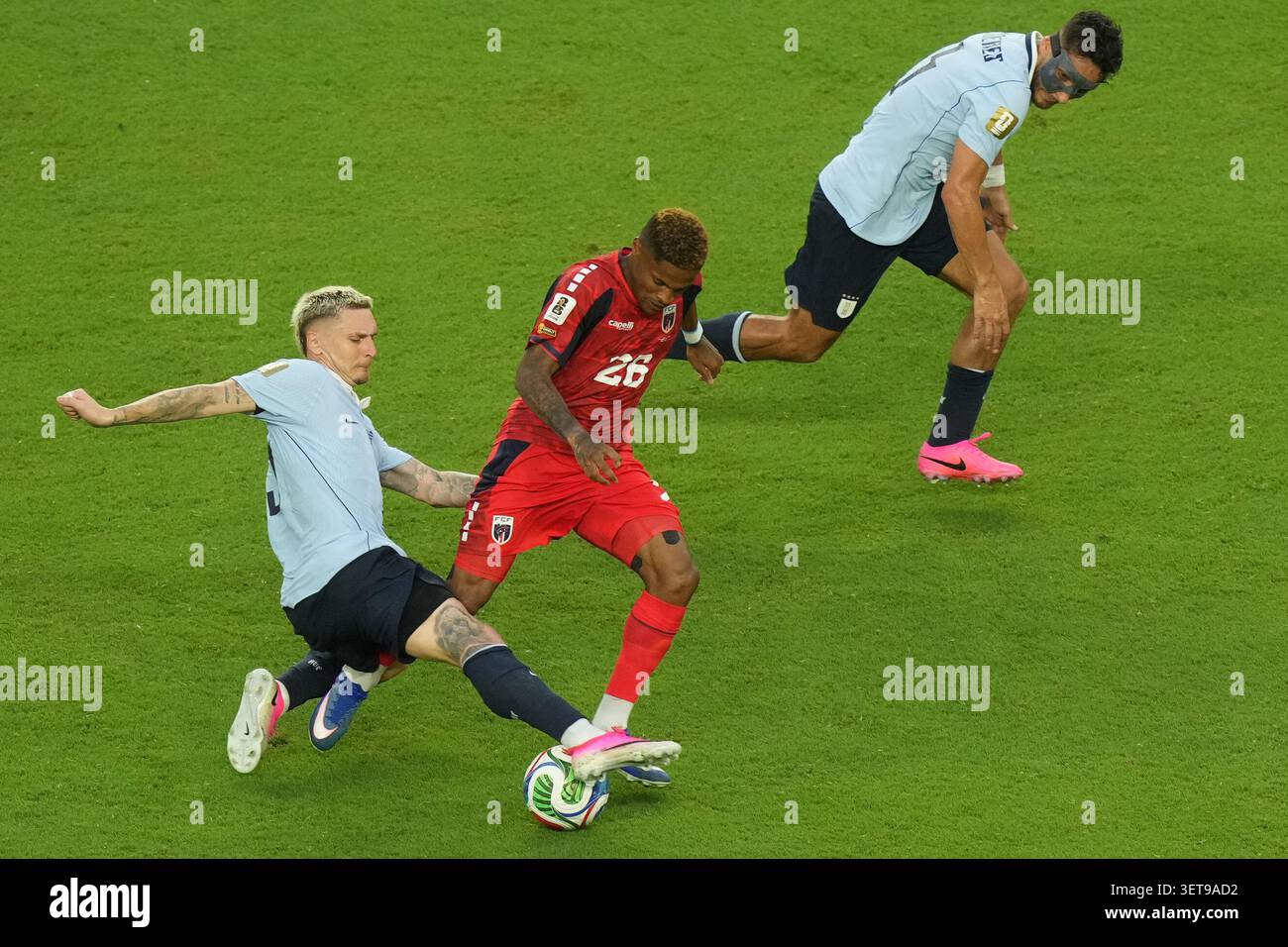 Cape Verde's Helio Varela, center, and Uruguay's Guillermo Varela ...