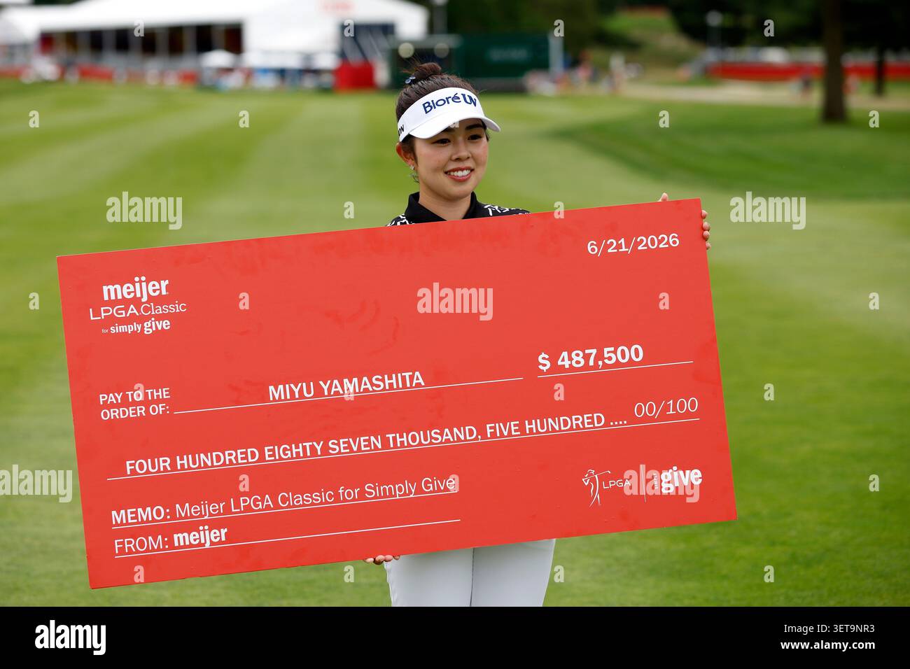 Miyu Yamashita, of Japan, holds her winning check after winning the ...