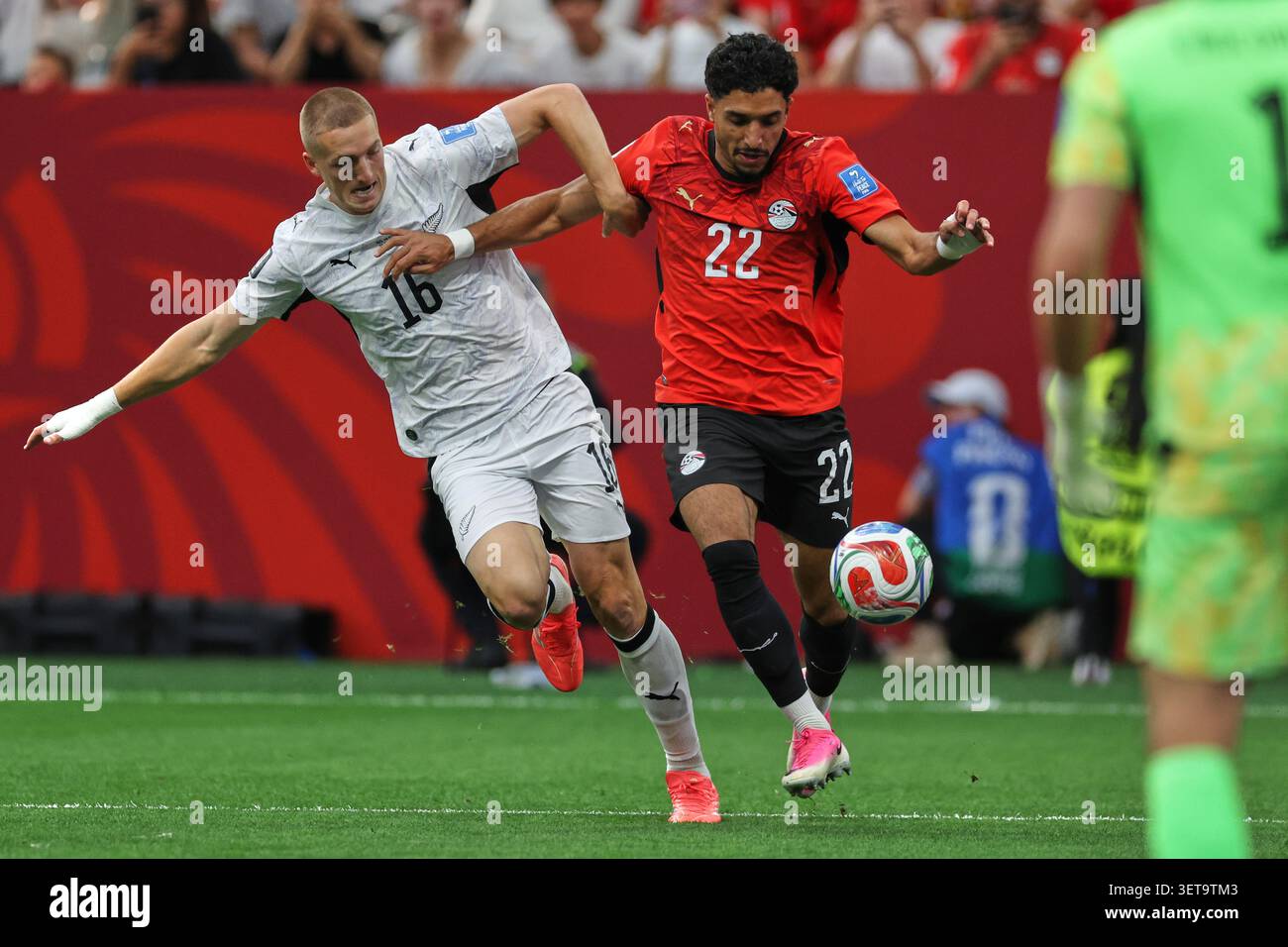 New Zealand's Finn Surman (16) and Egypt's Omar Marmoush (22) compete ...