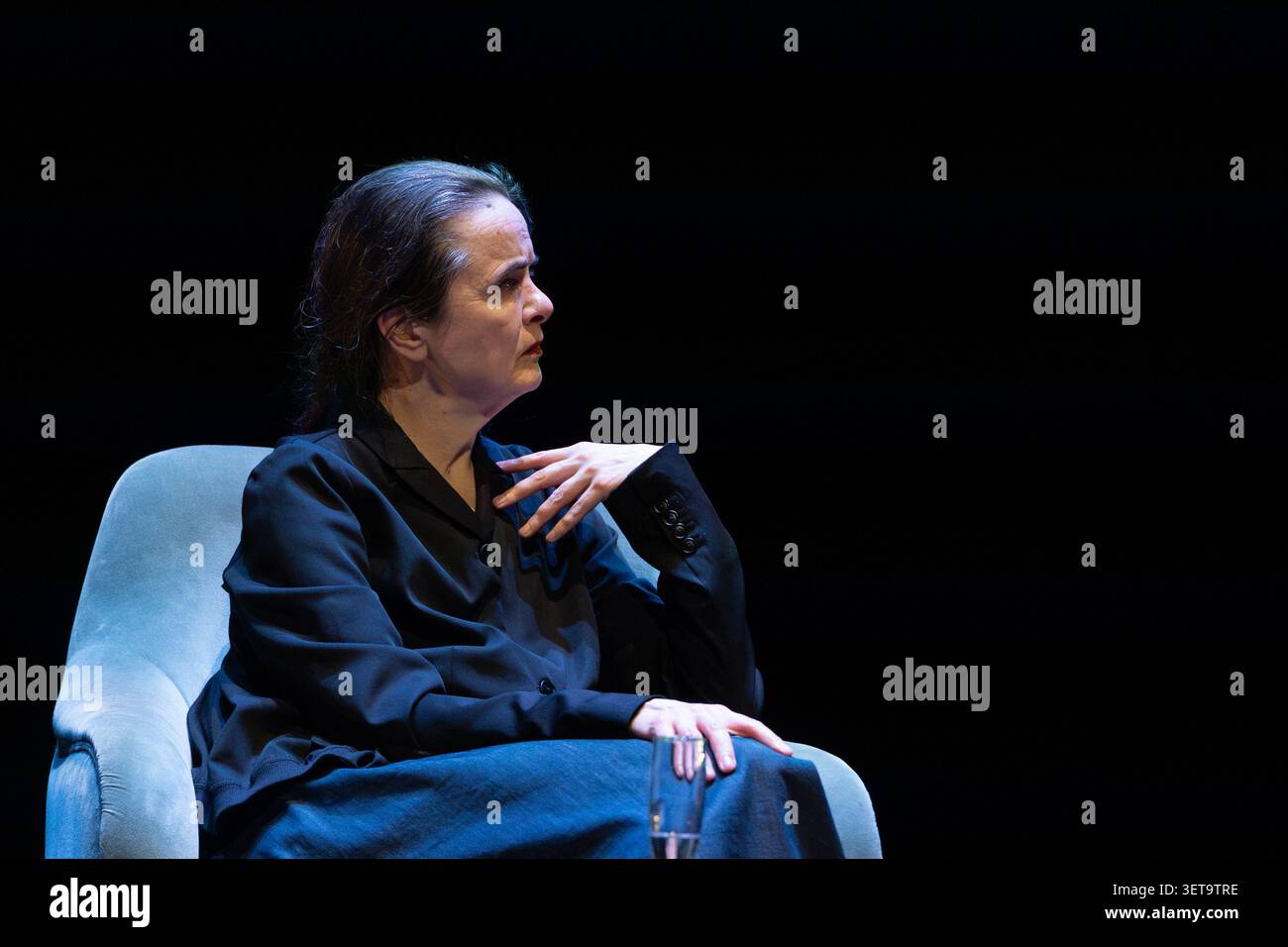 Side view of Amelie Nothomb listening with an elegant pose. Belgian ...