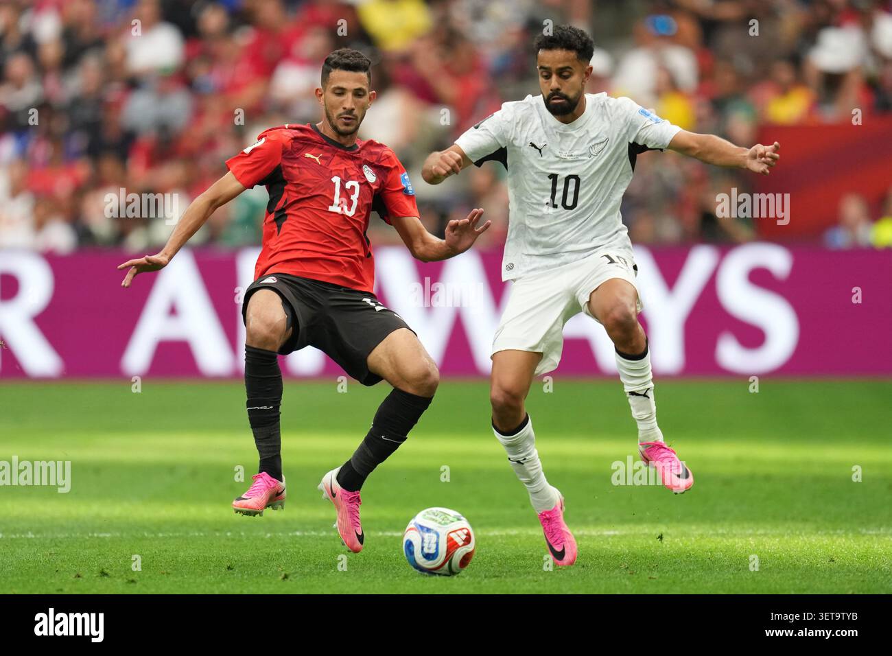 Egypt's Ahmed Fatouh (13) battles for the ball with New Zealand's ...
