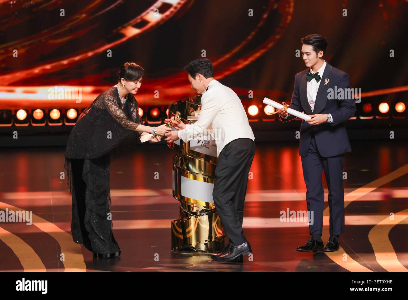 Chinese actors Carina Lau and Yu Shi present awards during the 28th ...