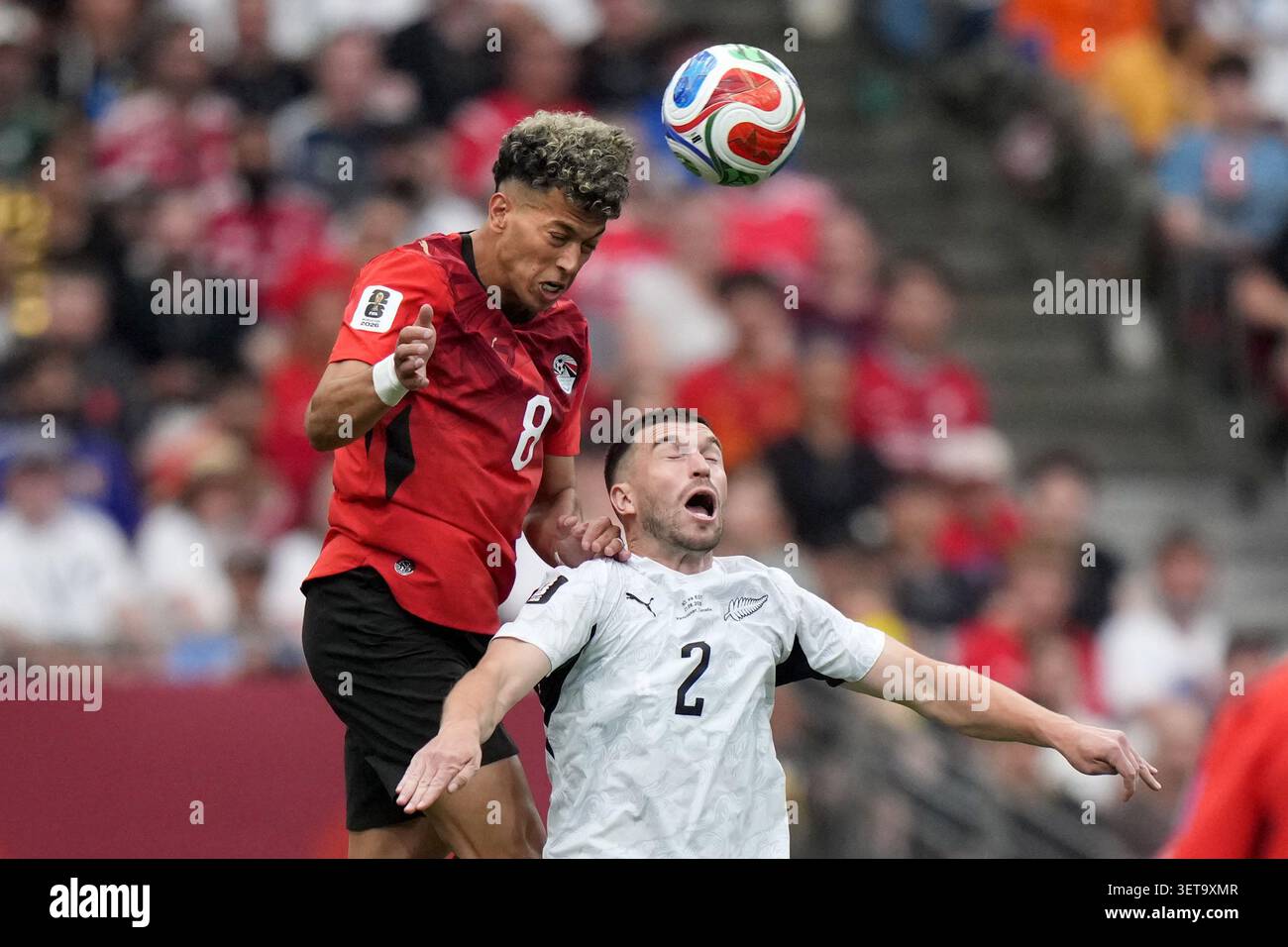 Egypt's Emam Ashour (8) gets the header over New Zealand's Tim Payne (2 ...