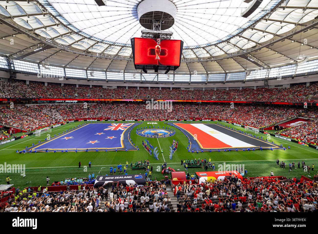New Zealand and Egypt's flags are spread across the field before the ...