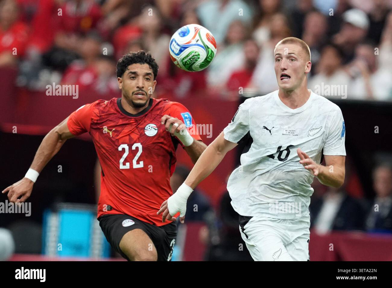 Egypt's Omar Marmoush (22) and New Zealand's Finn Surman (16) vie for ...