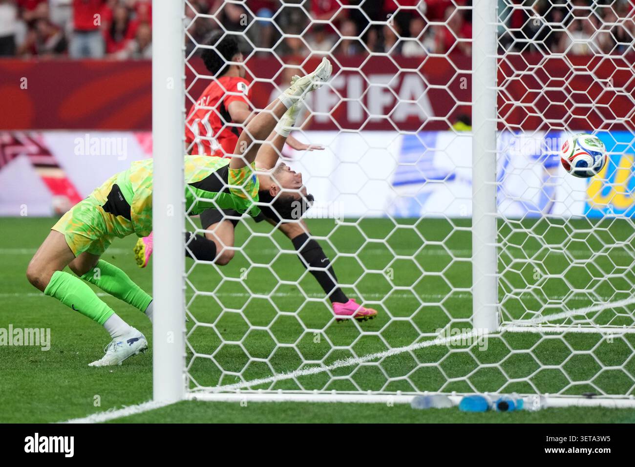 New Zealand's Max Crocombe (1) allows a goal to Egypt's Mostafa Ziko ...