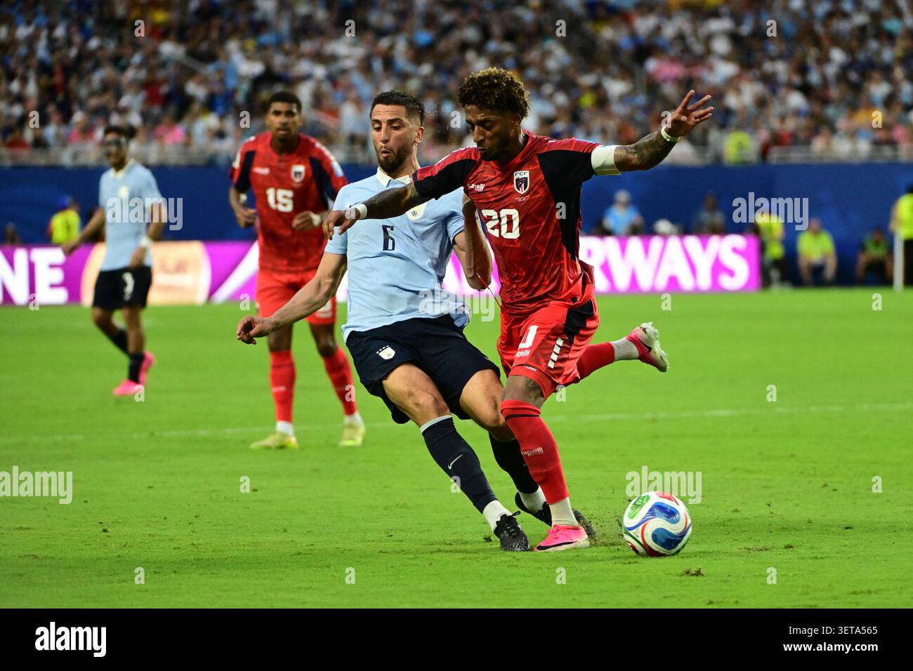 Cabo Verde forward Ryan Mendes #20 pushes down Uruguay midfielder ...