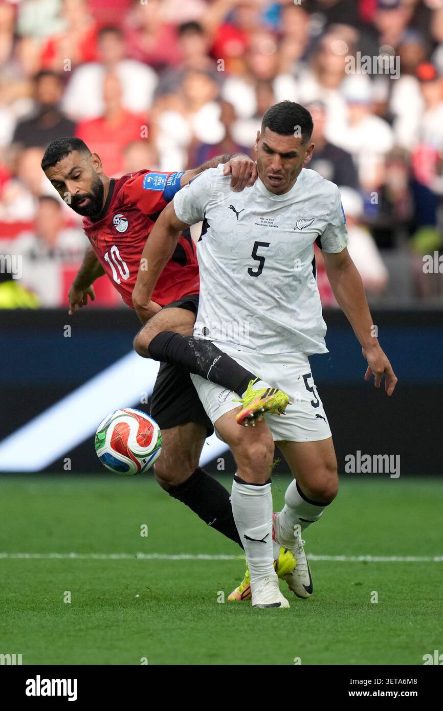 Egypt's Mohamed Salah (10) challenges New Zealand's Michael Boxall (5 ...