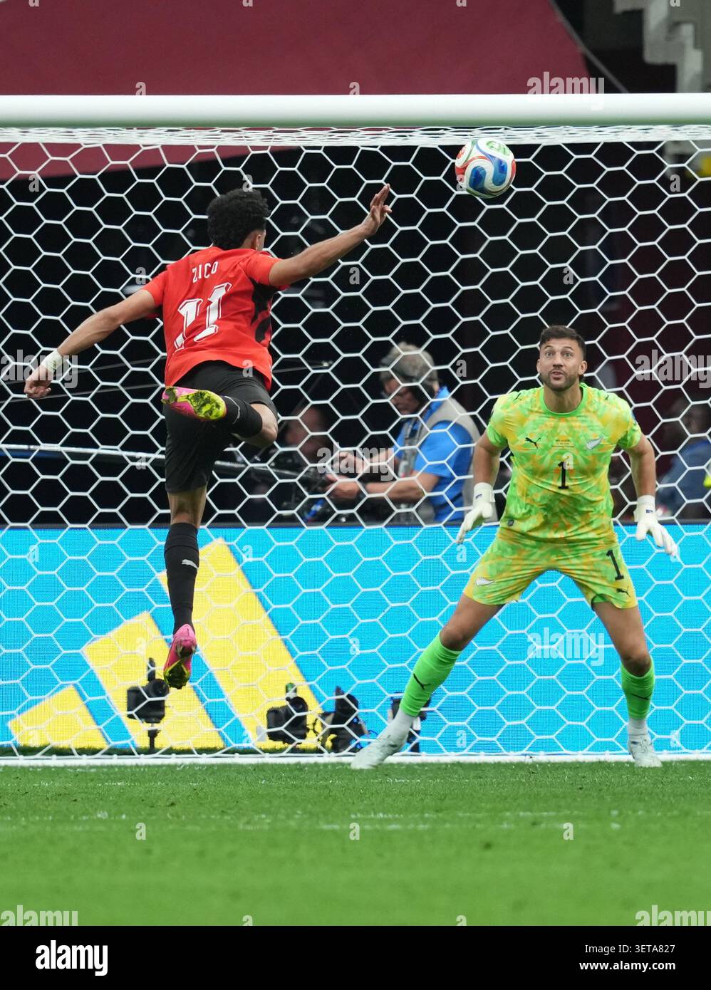 Egypt's Mostafa Ziko (11) scores on New Zealand's Max Crocombe (1 ...