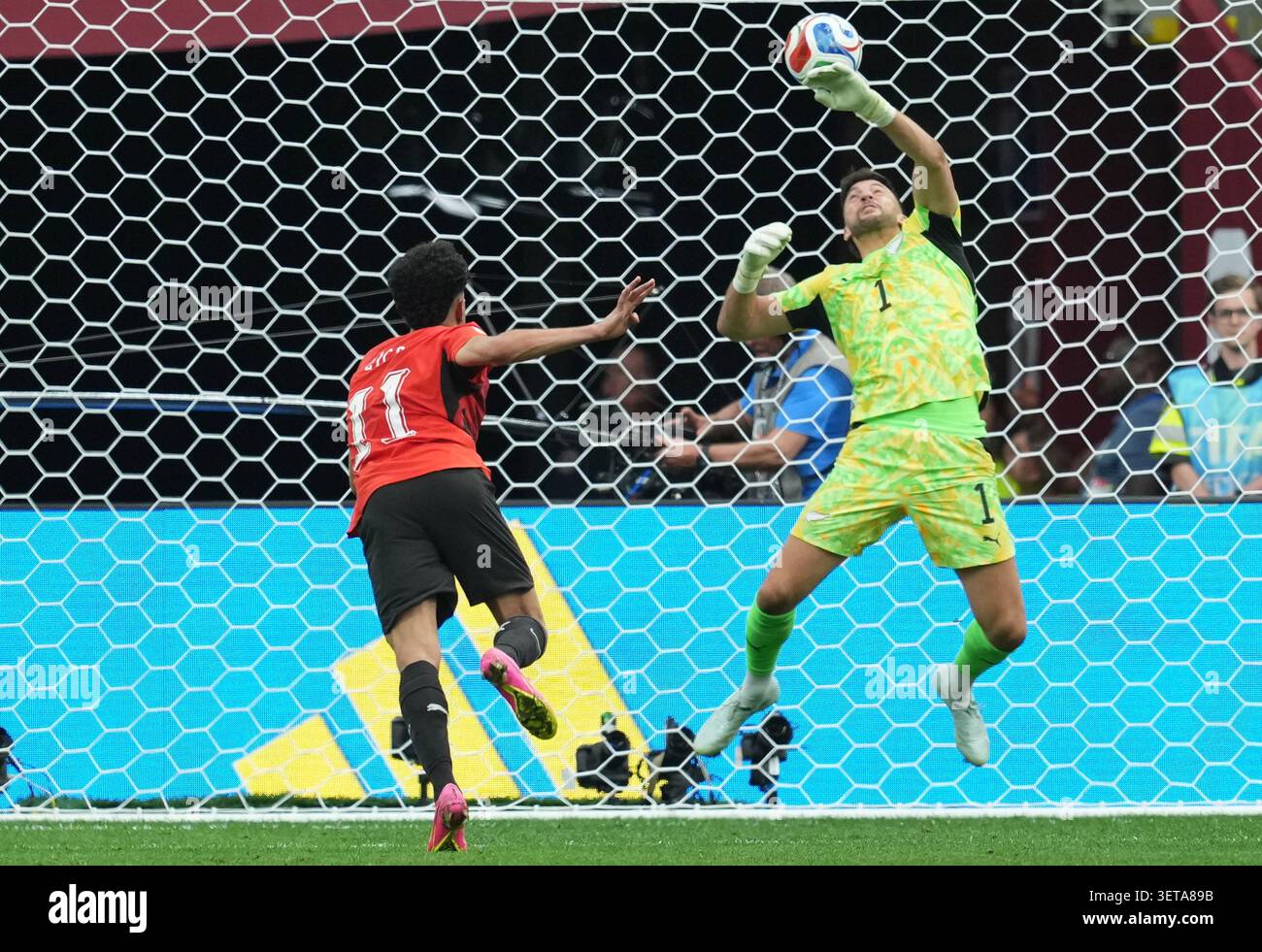 Egypt's Mostafa Ziko (11) scores on New Zealand's Max Crocombe (1 ...