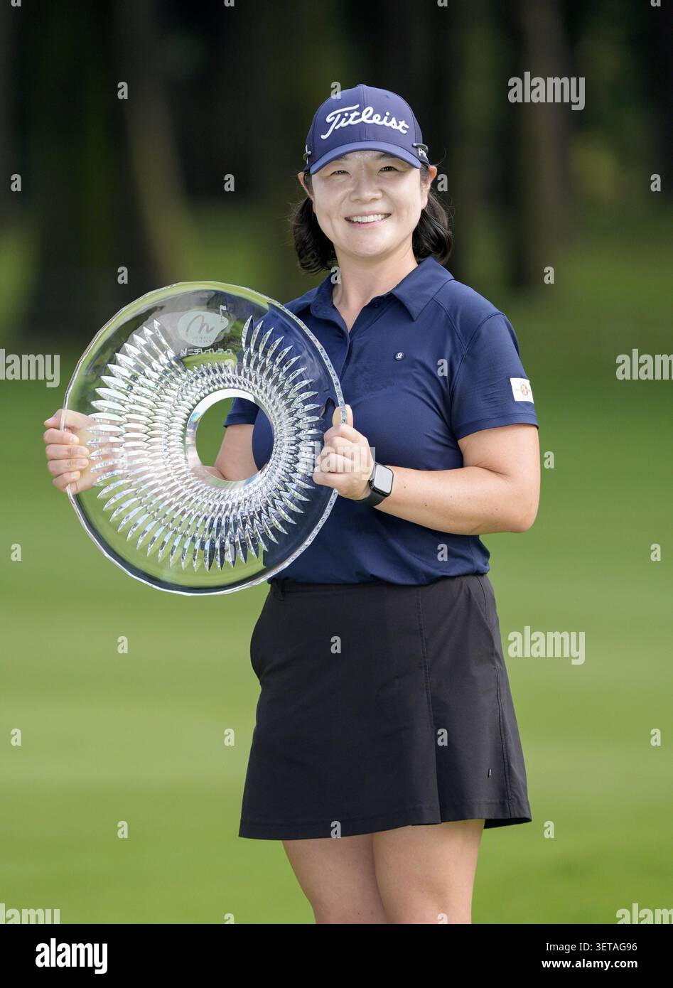 South Korea's Lee Min Young poses with the victor's trophy after ...