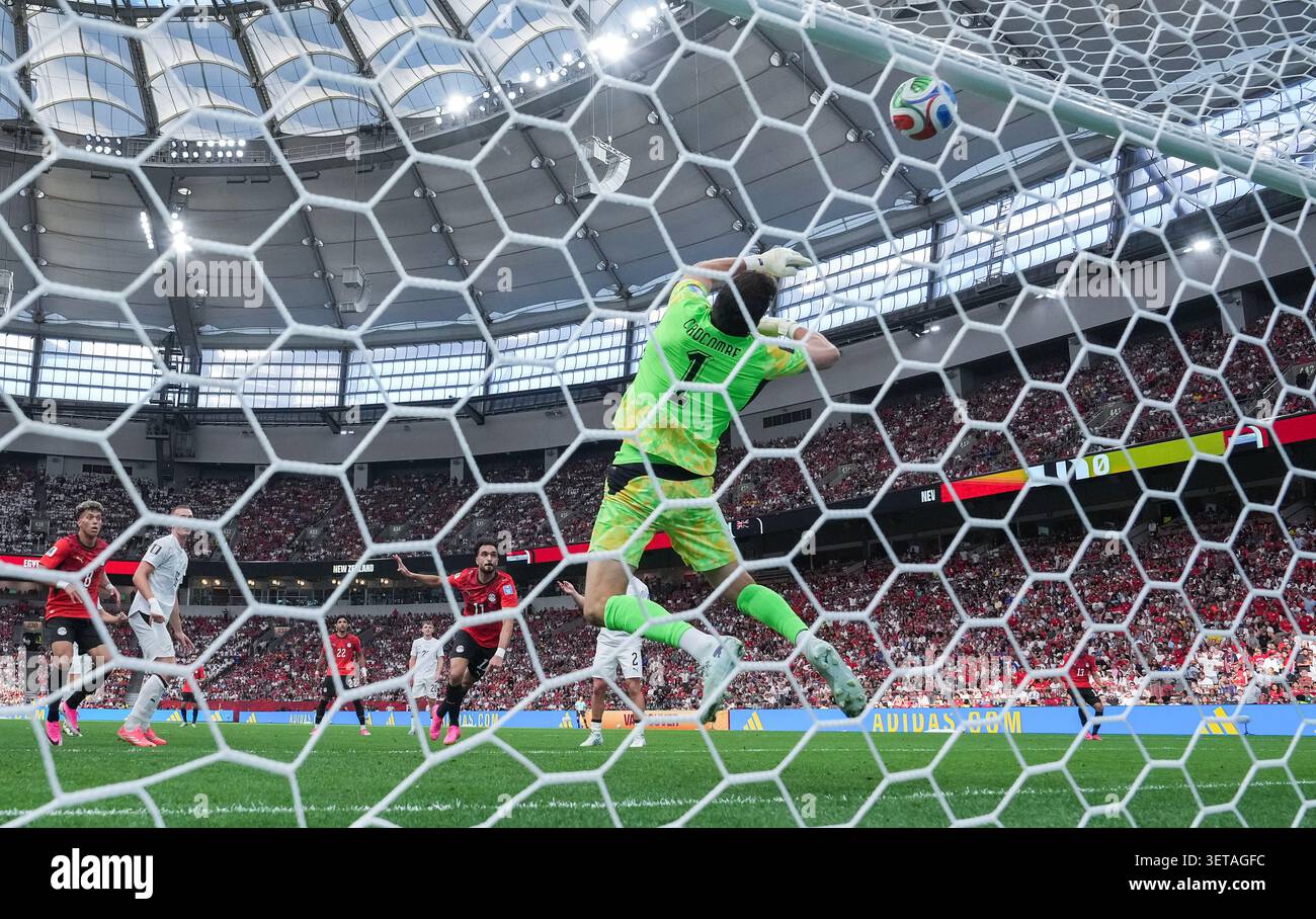 Egypt's Mostafa Zico (11) scores against New Zealand goalkeeper Max ...