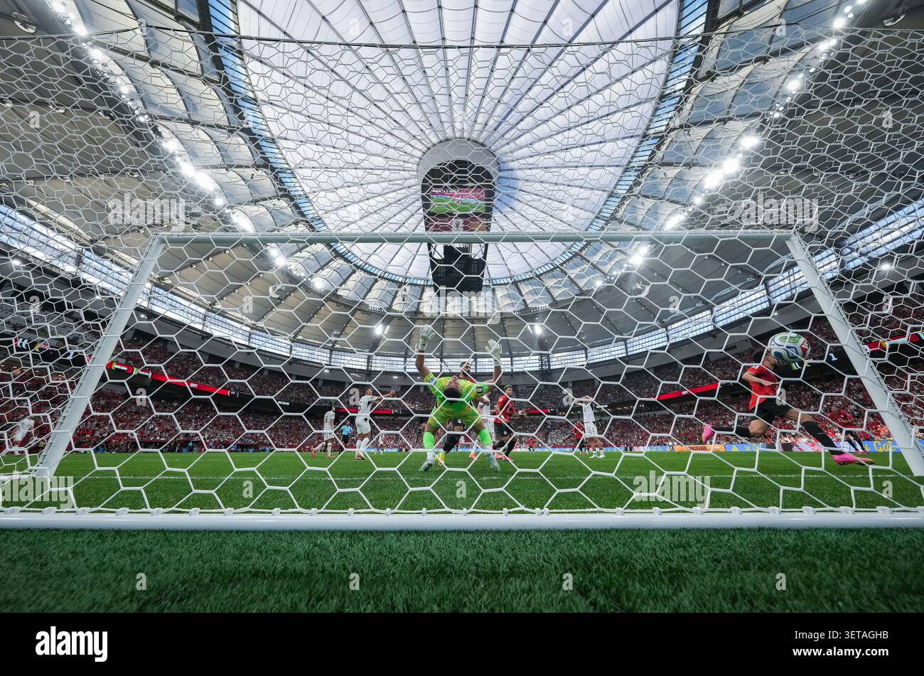 New Zealand goalkeeper Max Crocombe, centre, allows a goal to Egypt's ...
