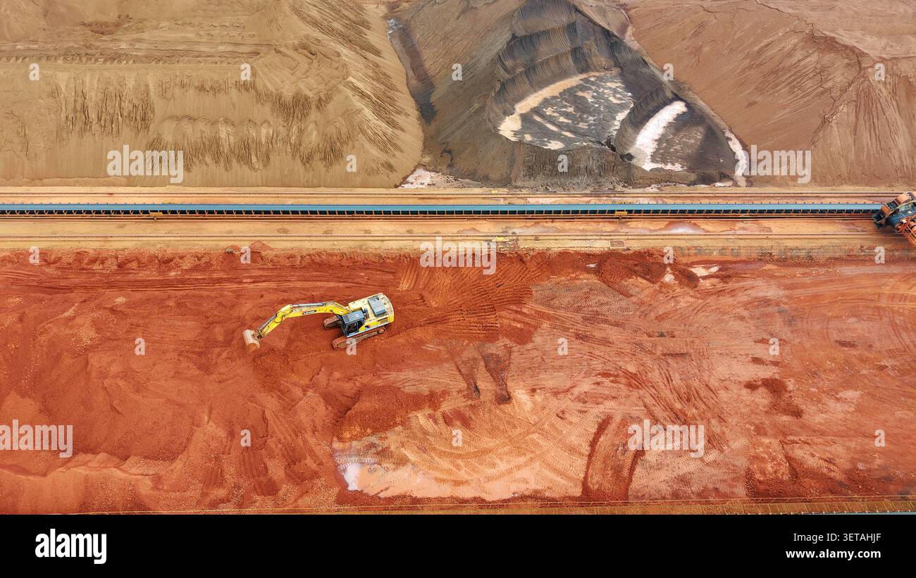 QINGDAO, CHINA - JUNE 22, 2026 - Construction machinery is sorting and ...