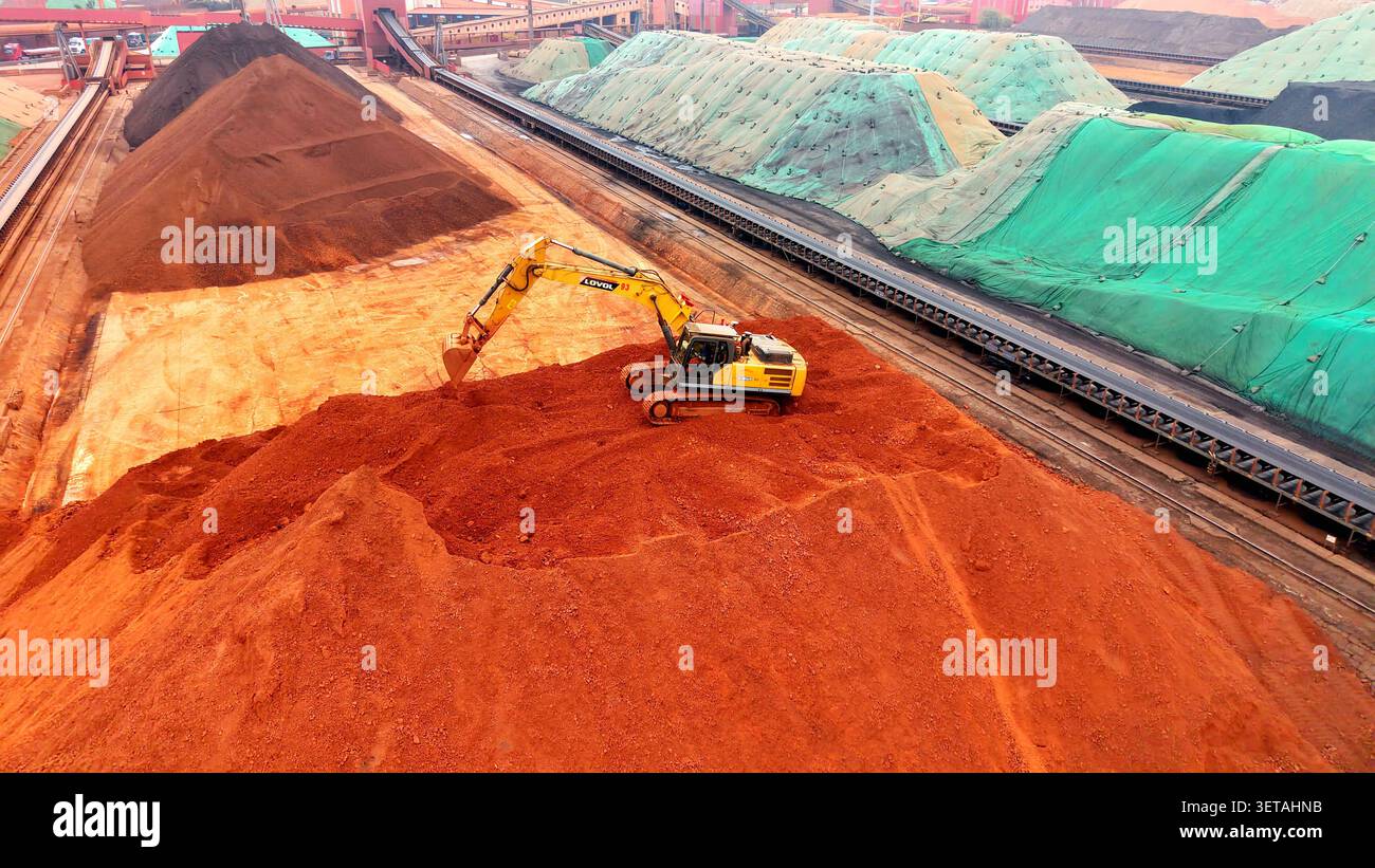 QINGDAO, CHINA - JUNE 22, 2026 - Construction machinery is sorting and ...