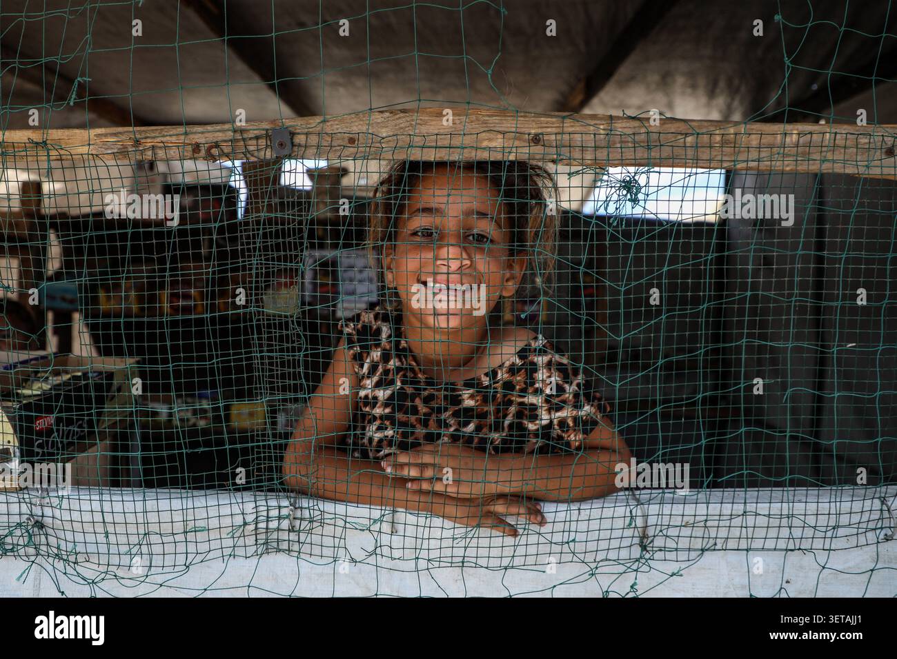 Palestinian children bathe in their tent inside a displacement camp in ...