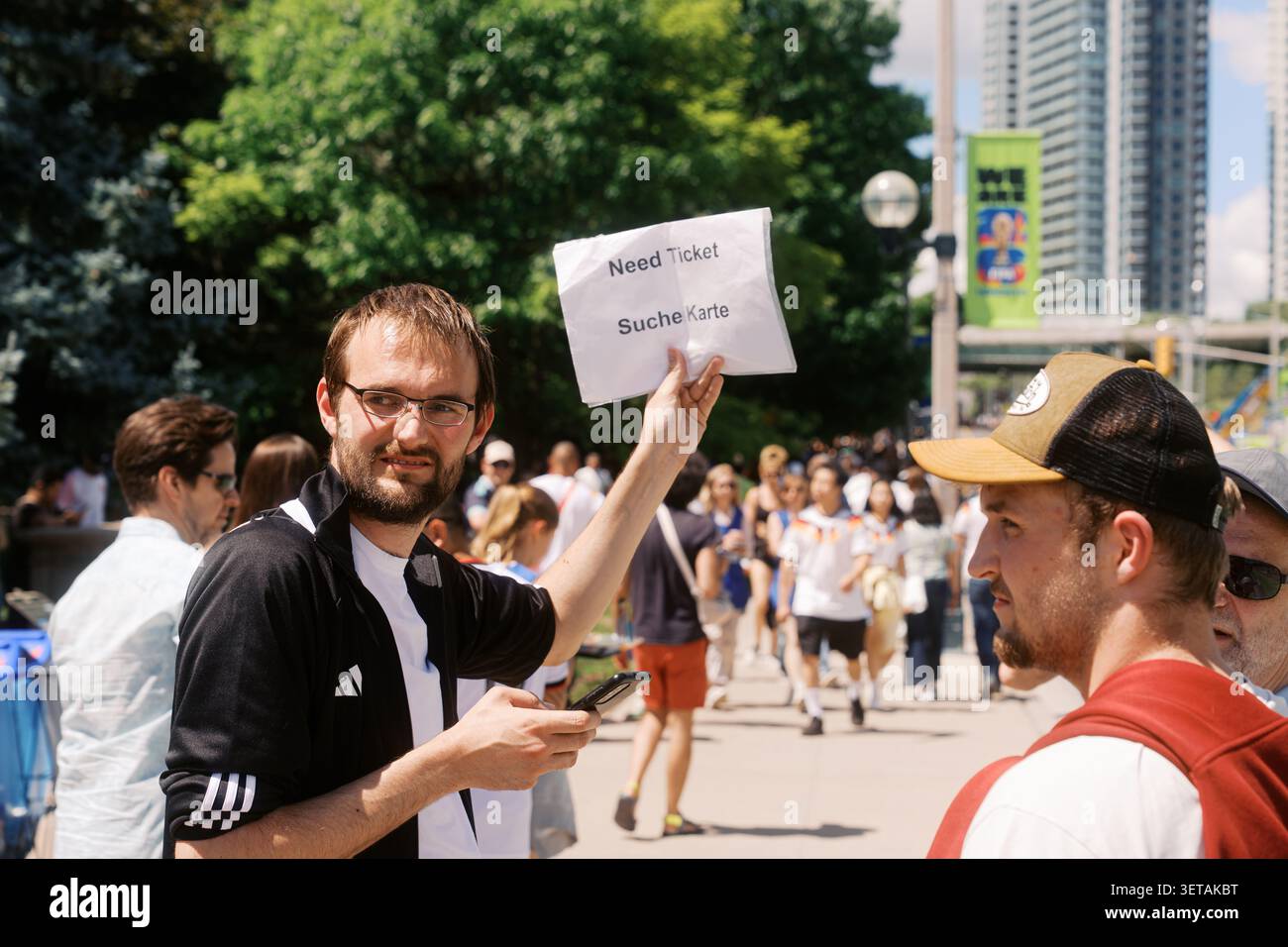 Toronto, Canada - June 20, 2026: German soccer fan holds sign seeking ...