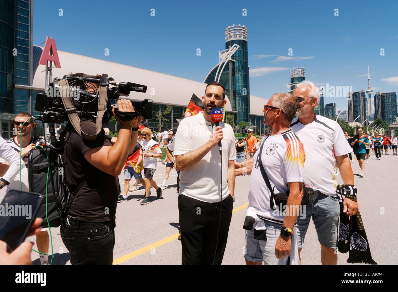 Toronto, Canada - June 20, 2026: German soccer fans interviewed by TV ...