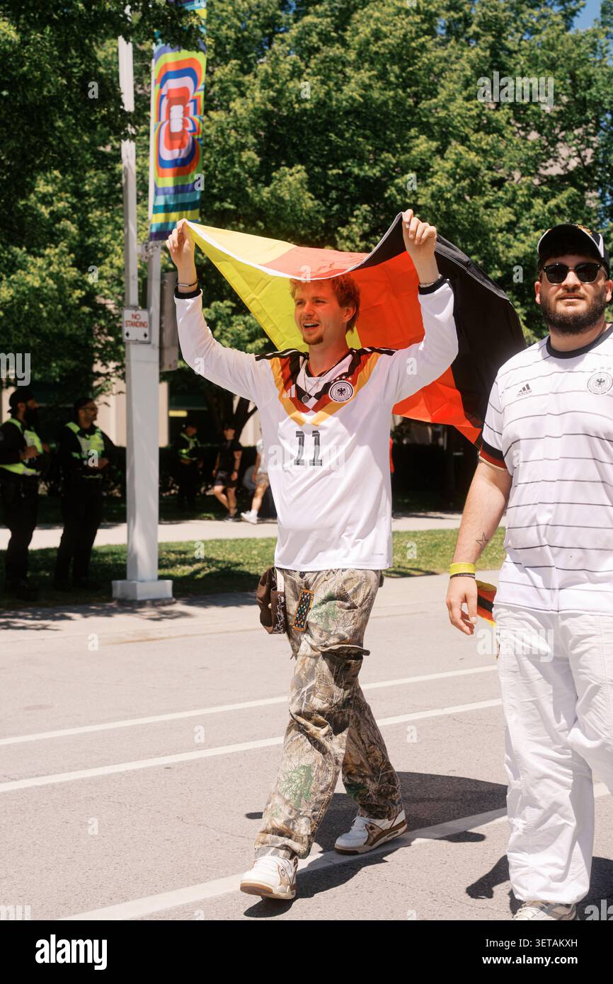Toronto, Canada - June 20, 2026: German soccer fans with flag walking ...