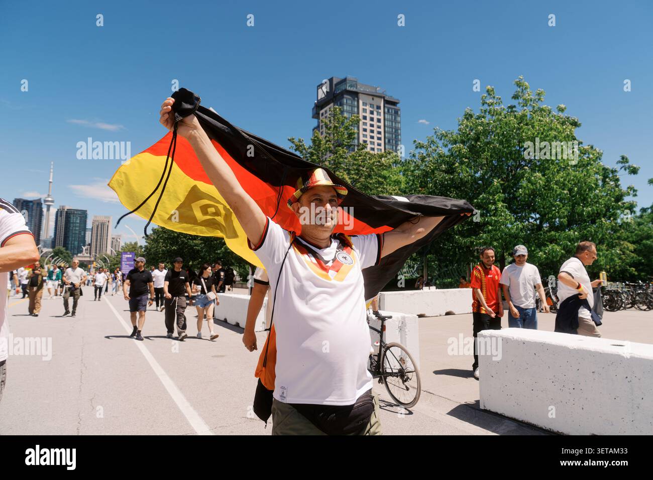 Toronto, Canada - June 20, 2026: German soccer fan with flag walking to ...
